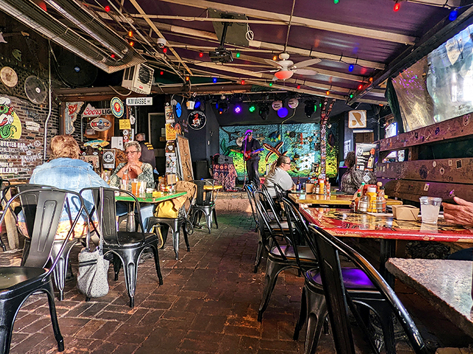 Inside, colorful string lights and eclectic decor create the perfect backdrop for seafood feasts and live music that keeps the place humming.