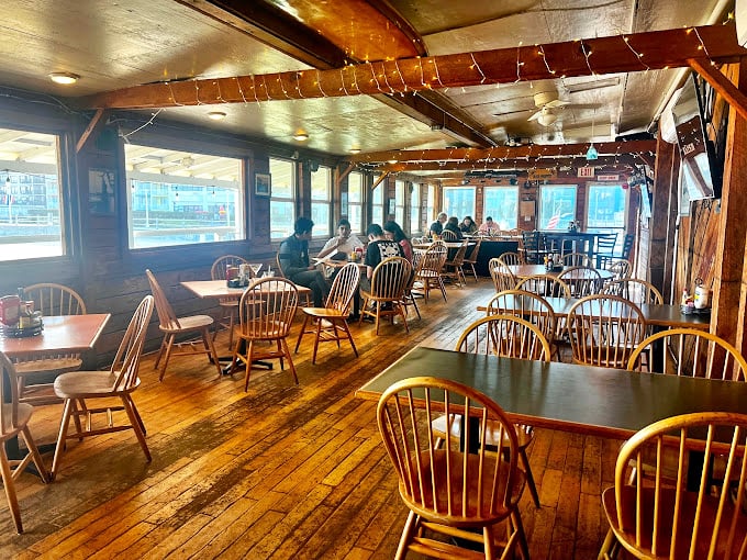 Wooden beams, simple chairs, and string lights create the perfect unpretentious backdrop for seafood that doesn't need fancy surroundings to shine.
