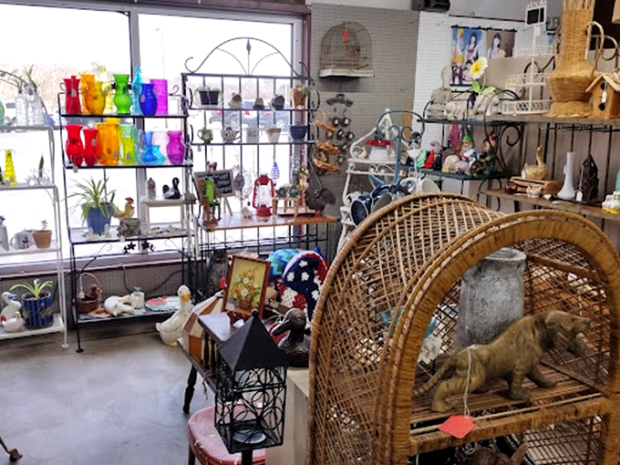 A rainbow of vintage glassware catches the light while wicker furniture waits for its next story. Every corner offers a new discovery.