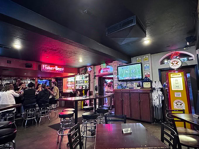 Where burger dreams come true. The neon-lit interior combines classic bar ambiance with the promise of impending culinary bliss.
