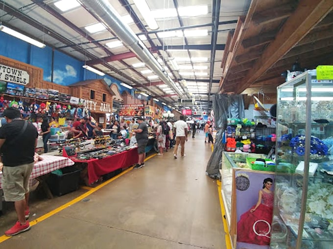 A bustling indoor thoroughfare where haggling is an art form and yellow floor lines serve as your treasure map through this retail wonderland.