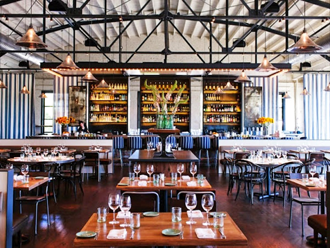 Where seafood dreams come true: The Optimist's oyster bar invites you to pull up a mint-green stool and watch culinary magic unfold.