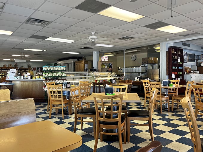 Classic checkered floors and wooden chairs create that perfect small-town diner atmosphere where conversations flow as freely as the coffee.