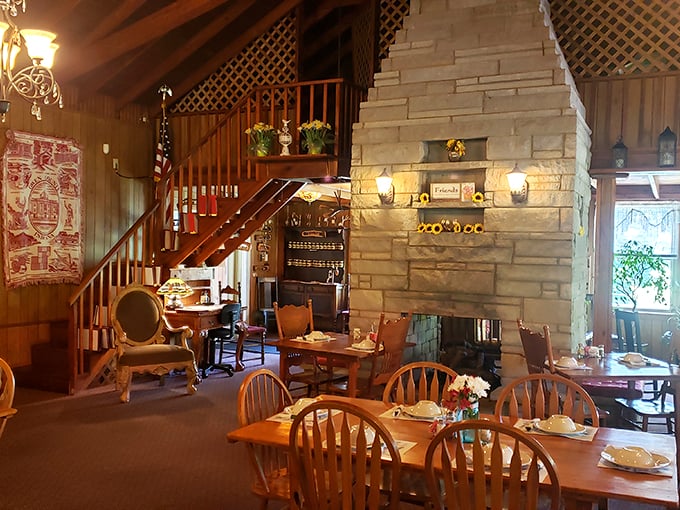 That stone fireplace isn't just architectural showboating; it's the soul of this dining room where comfort food meets actual comfort.