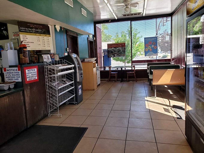 Simplicity reigns inside where fluorescent lights illuminate what matters most—the path to donut nirvana.