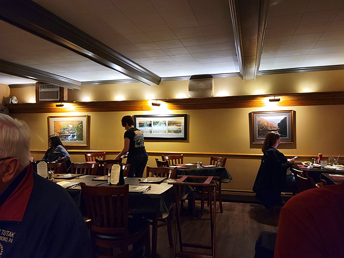 Inside, warm wood tones and tasteful lighting create the perfect atmosphere for enjoying a memorable meal without the pretension of big-city steakhouses.