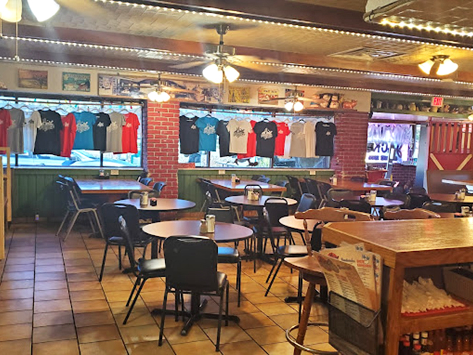 Inside, time stands still in the best possible way. T-shirts hang like trophies, ceiling fans spin lazily, and regulars claim their usual spots.