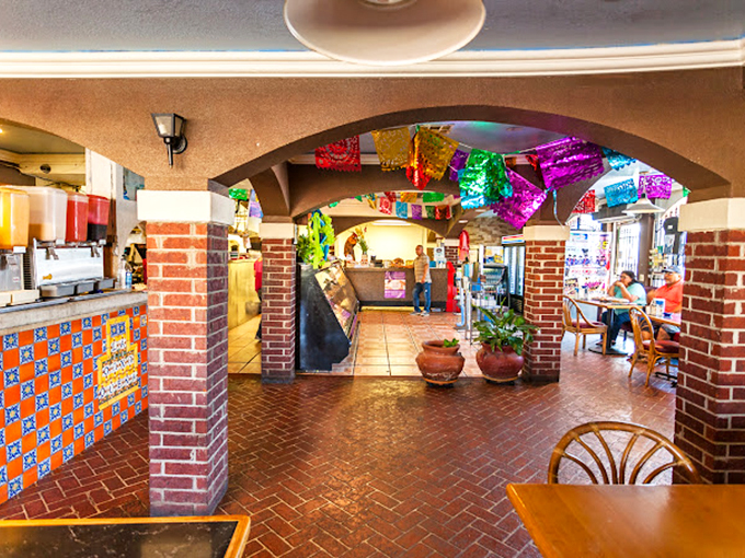 Step through these brick archways and you're transported straight to Oaxaca, complete with colorful papel picado banners that flutter like tasty promises overhead.