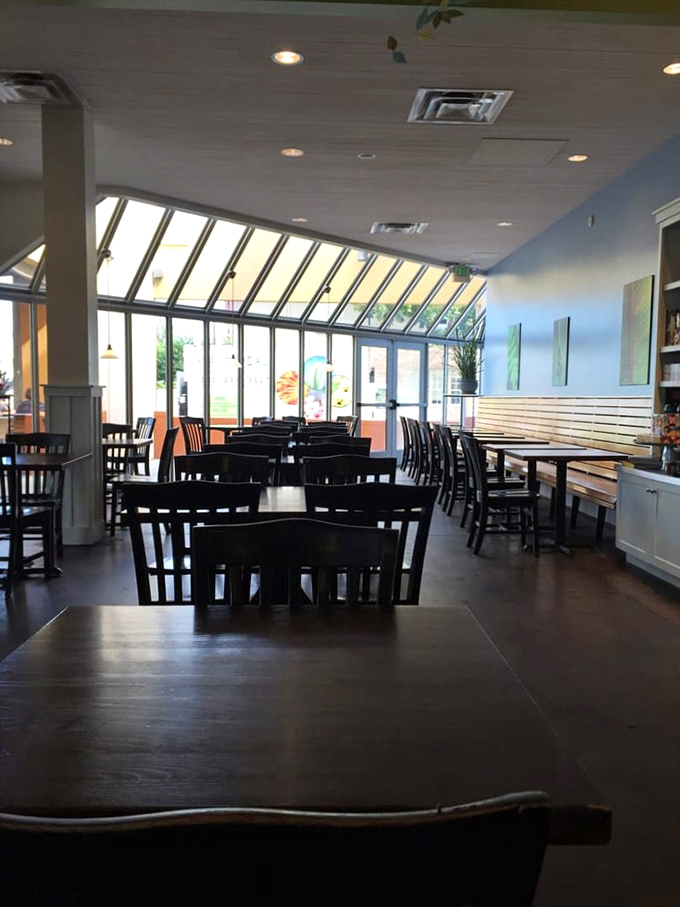 Sunlight floods through floor-to-ceiling windows, creating the perfect backdrop for both serious breakfast deliberations and leisurely weekend catch-ups.