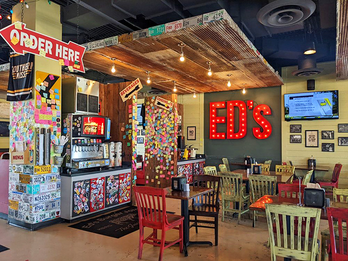 Inside, mismatched chairs and that glowing red sign create the perfect backdrop for burger-based memories. License plates and Post-its tell stories of satisfied pilgrims.