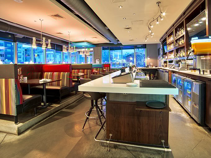 Interior design that says "we take food seriously, but ourselves? Not so much." The colorful striped booths invite you to settle in and stay awhile.