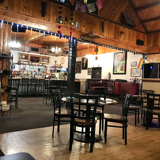 Warm wooden beams, twinkling string lights, and an inviting bar create the perfect backdrop for food that demands your full attention. Like a mountain cabin that happens to serve incredible burgers.