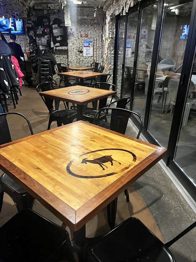 Dollar bills wallpaper every surface, each one a testament to a satisfied customer. It's like dining inside the world's tastiest piggy bank.