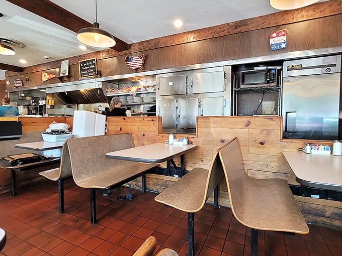 Classic diner aesthetics with wood paneling and no-nonsense seating. This isn't Instagram-pretty; it's American-authentic, where memories are made over coffee.