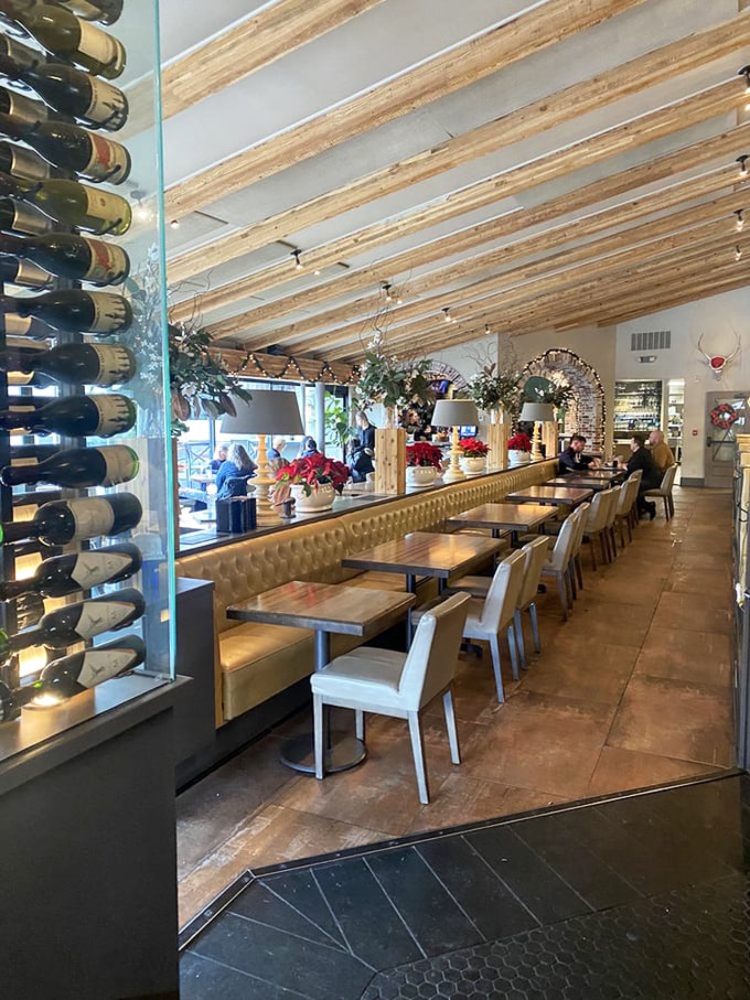 Wooden ceiling beams, sleek wine displays, and comfortable seating create that perfect "fancy but not fussy" atmosphere where memorable meals become lifelong stories.
