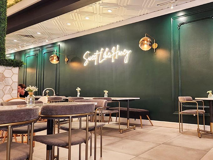 Rich emerald walls and that "Sweet Like Honey" glow create the perfect backdrop for food that demands your full attention. Bring someone you actually like talking to.