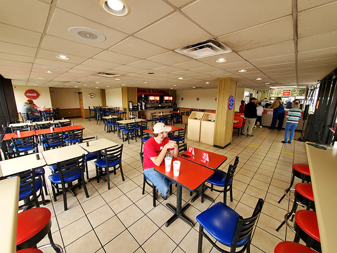 Inside, the simple red-topped tables and blue chairs create a democratic dining space where doctors, truckers, and everyone in between comes together for comfort food excellence.