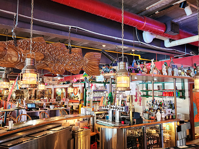 Wooden fish overhead, lanterns aglow &ndash; this isn't just a bar, it's an underwater treasure chest where drinks and stories flow freely.