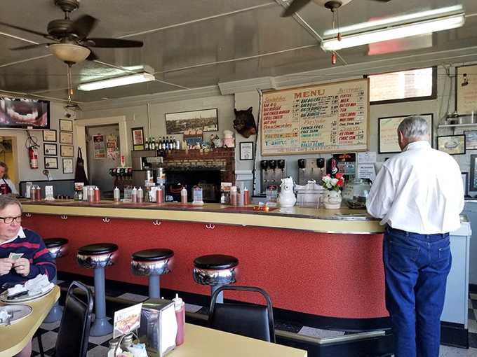 That classic lunch counter with spinning stools isn't retro by design&mdash;it's authentic by survival. Decades of barbecue wisdom served daily.