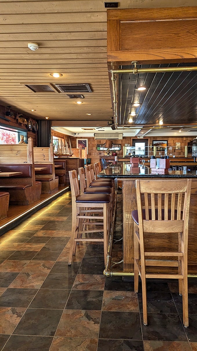 Warm wooden paneling and comfortable bar seating create the perfect nautical hideaway. You'll forget you're miles from any ocean.