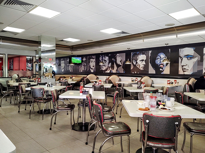 The interior's pop culture portrait gallery watches over diners like breakfast celebrities, silently approving your decision to order that extra side of bacon.