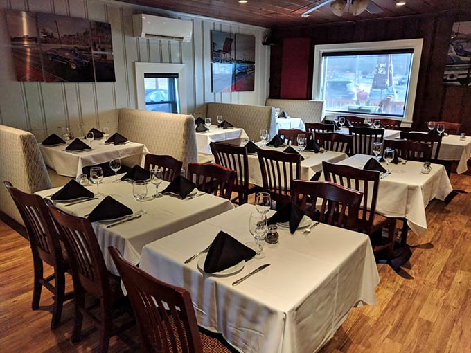 White tablecloths against wooden chairs create that perfect "we're serious about food but not stuffy" atmosphere that makes memorable meals possible.