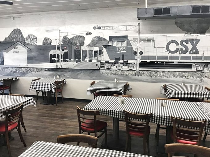 Classic black and white checkered tablecloths set against a nostalgic train mural&mdash;dining here is like eating in your grandmother's kitchen, if she could cook for an army.