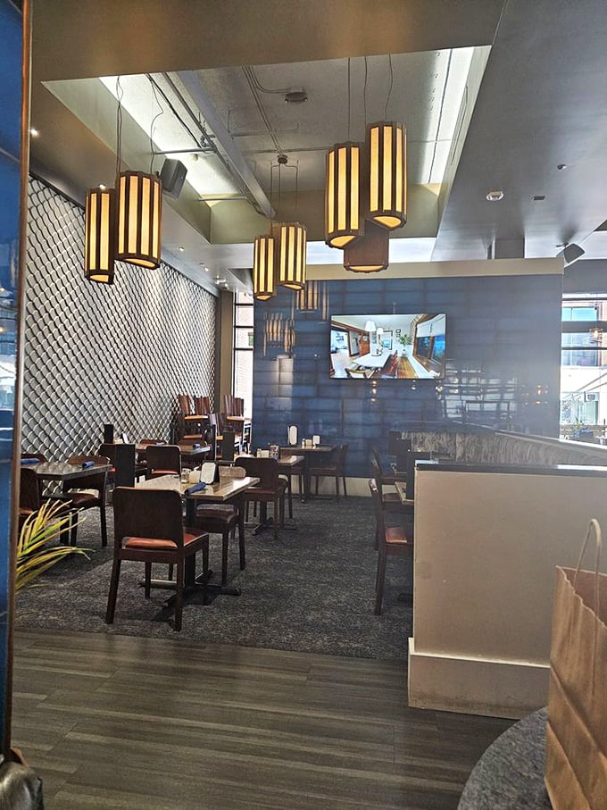 Nautical elegance meets Midwest hospitality. Those warm wooden accents and distinctive pendant lights create an atmosphere that whispers "vacation" while still feeling like home.