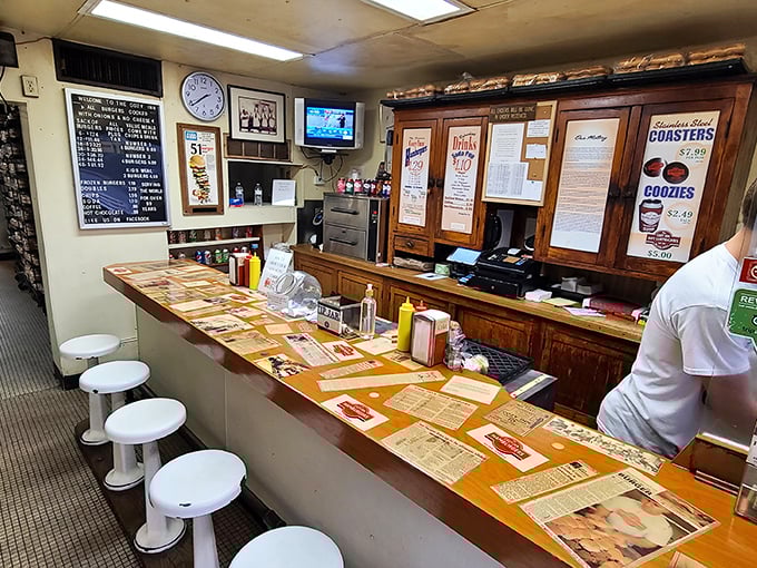 Six stools, one counter, and a century of burger history. This tiny space has served more sliders than most stadiums.