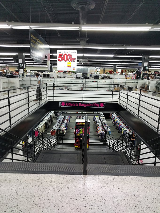 Descend into "Olivia's Bargain City" where racks of clothing await like colorful chapters of a fashion history book.