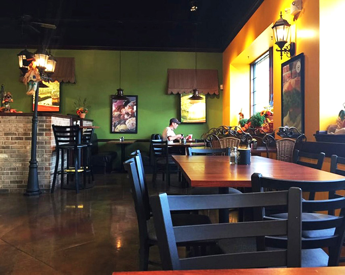 Warm green and yellow walls create a cozy atmosphere where patrons can linger over coffee and cheesecake &ndash; a homey retreat from the outside world.