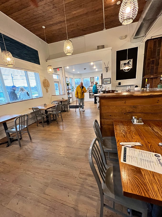 Wooden beams, wicker pendant lights, and rustic charm create the perfect backdrop for memorable meals. It's like dining in your stylish friend's dream kitchen.