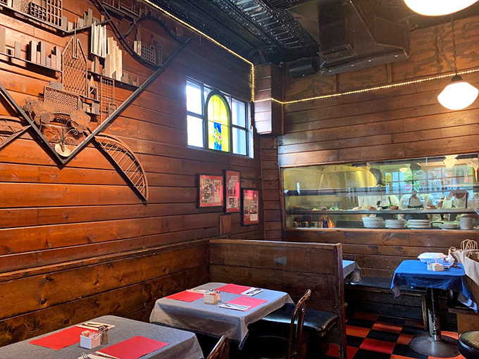 A bar that feels like it's been telling stories for generations. The wood-paneled warmth and classic stools invite you to stay awhile.