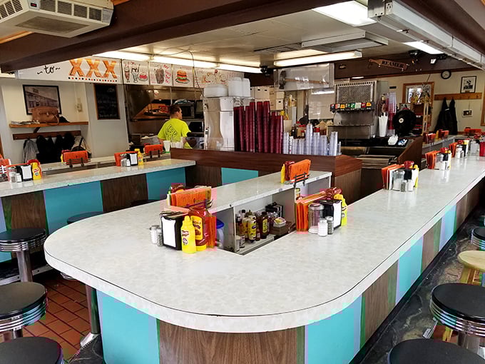 The horseshoe counter isn't retro-chic by design&mdash;it's authentic by longevity. Where strangers become friends over shared condiment caddies and burger anticipation.