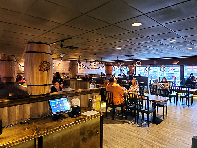 Wooden barrels and nautical touches transform this suburban spot into a maritime getaway. It's like the Love Boat crashed into a cozy tavern.