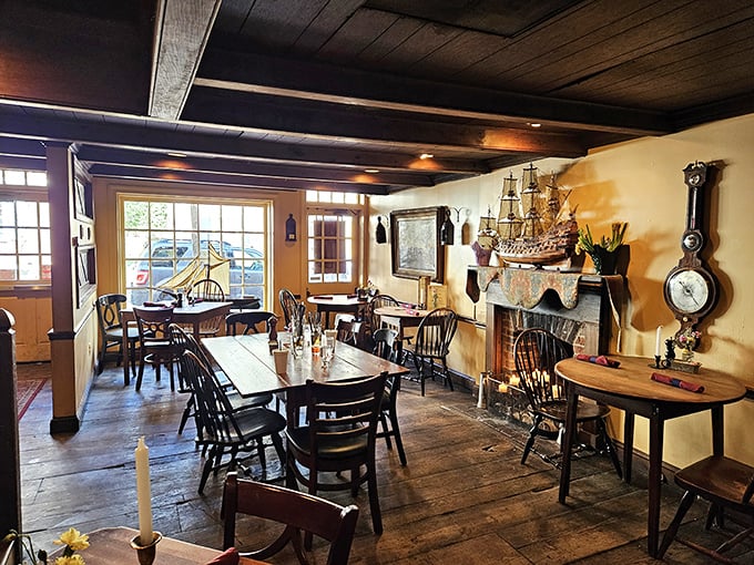 Step back three centuries into a dining room where wooden beams, Windsor chairs, and a crackling fireplace create the perfect setting for culinary time travel.