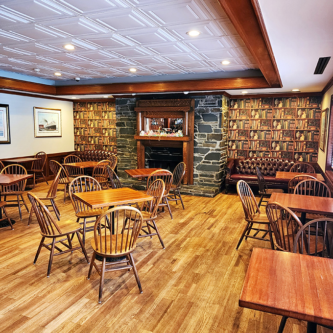 Step into a time capsule of Southern comfort with wood paneling, Windsor chairs, and a stone fireplace that practically whispers, "Stay awhile, y'all."