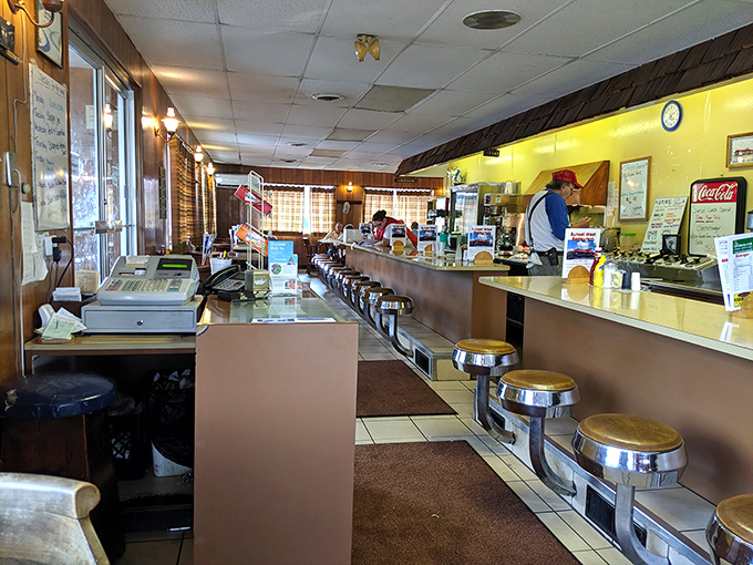 Counter seating that invites conversation with strangers who become friends over coffee &ndash; the beating heart of Sunset West's community atmosphere. 