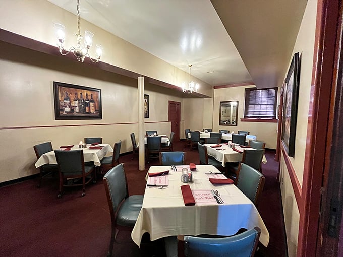 White tablecloths and blue chairs create a dining room that whispers "special occasion" without shouting it&mdash;the kind of place where memories marinate alongside the steaks.