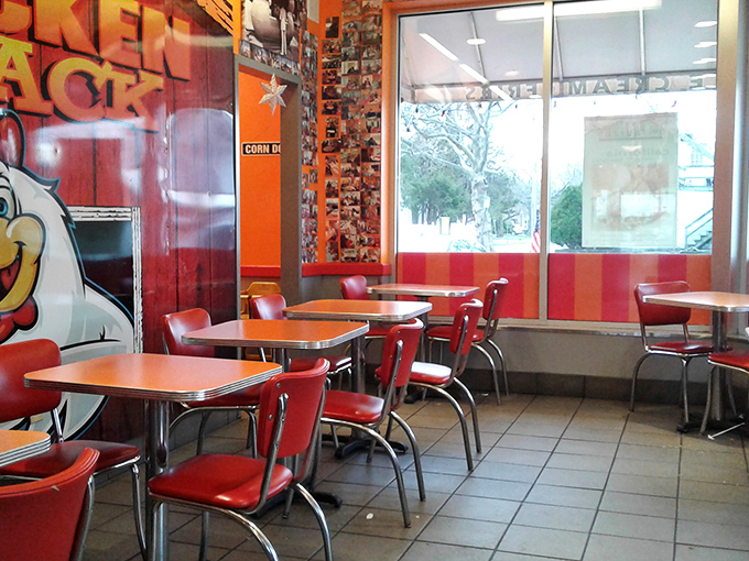 Retro charm meets comfort food heaven inside, where those cherry-red chairs have witnessed countless "first bite" moments of pure culinary bliss.