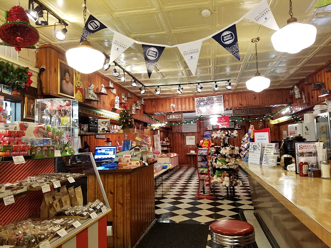 Step into a time machine disguised as a chocolate shop, where wood paneling and checkered floors transport you to simpler, sweeter times.