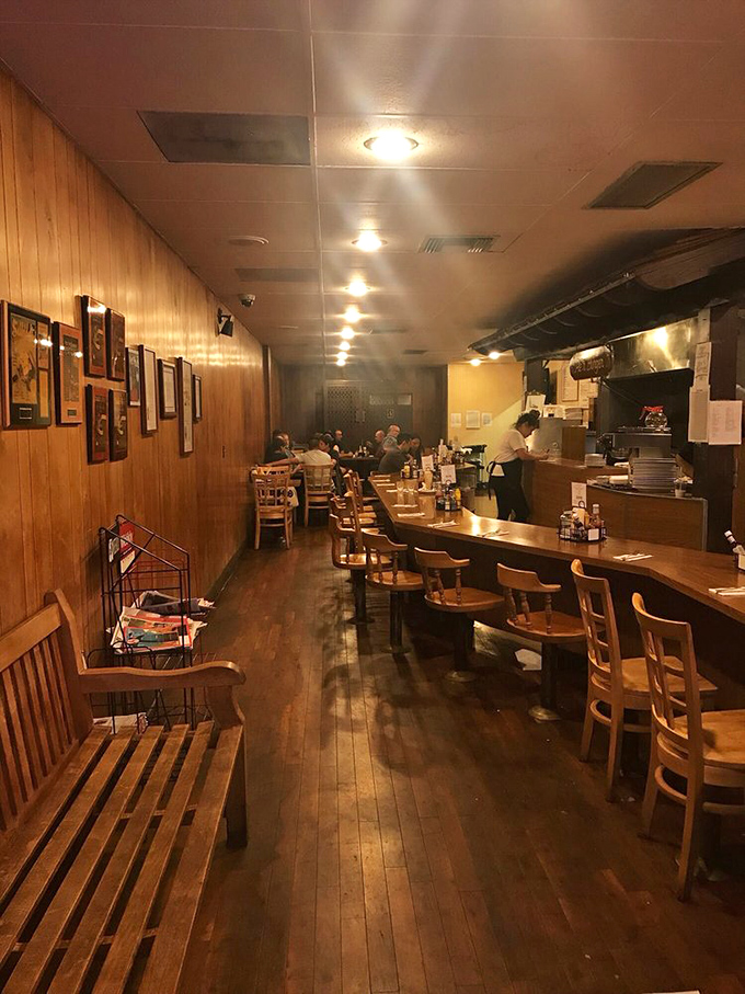 Step inside and you're transported to a simpler time. Wood-paneled walls, counter seating, and the gentle hum of conversation create the perfect burger sanctuary.