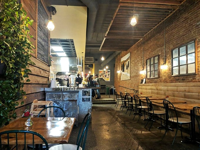 Edison bulbs cast a warm glow over wooden tables where food dreams come true. The exposed brick walls aren't trying to impress&mdash;they're just being authentically themselves. 