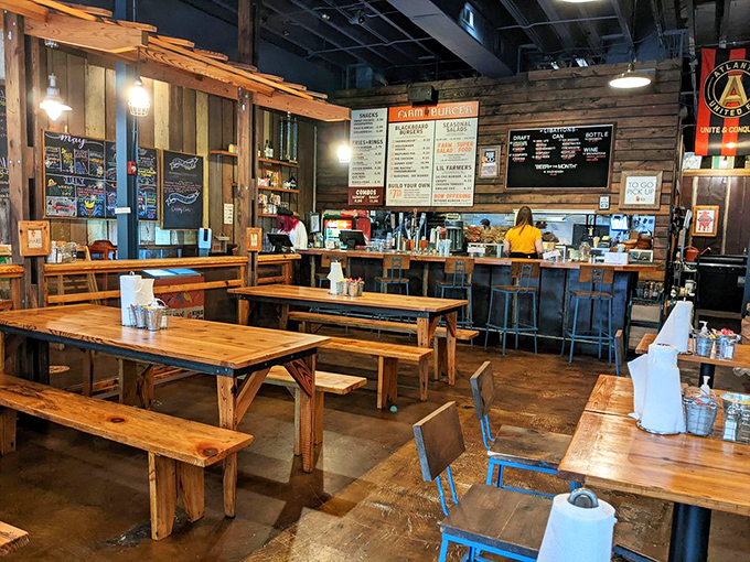 Communal tables and reclaimed wood create that "welcome to our farmhouse" vibe. It's like Joanna Gaines designed a burger joint that actually serves amazing food.