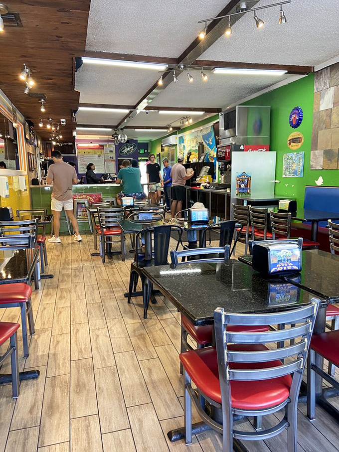 Inside, the vibrant green walls and casual seating create the perfect backdrop for the serious burger business happening at the counter.