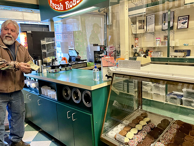 The classic green counter and display case – donut theater at its finest. This is where dreams come true and diets go to die.