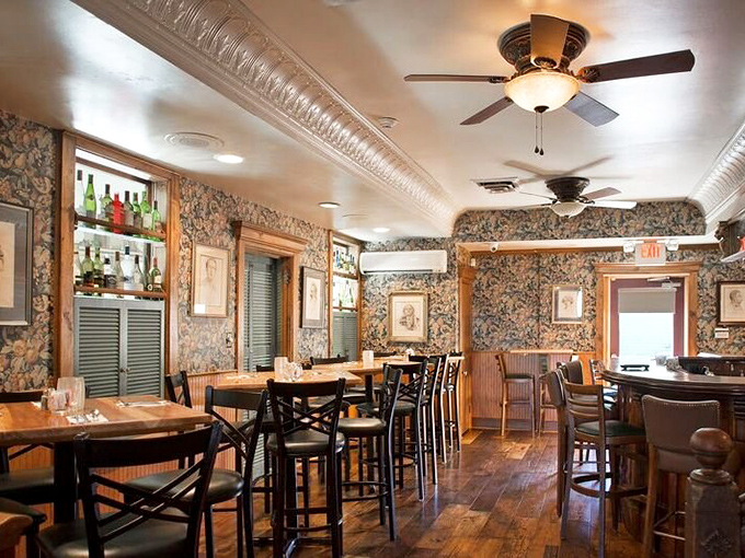 Inside, floral wallpaper meets wood paneling in a d&eacute;cor scheme I call "Grandma's fancy room where you weren't allowed to sit."