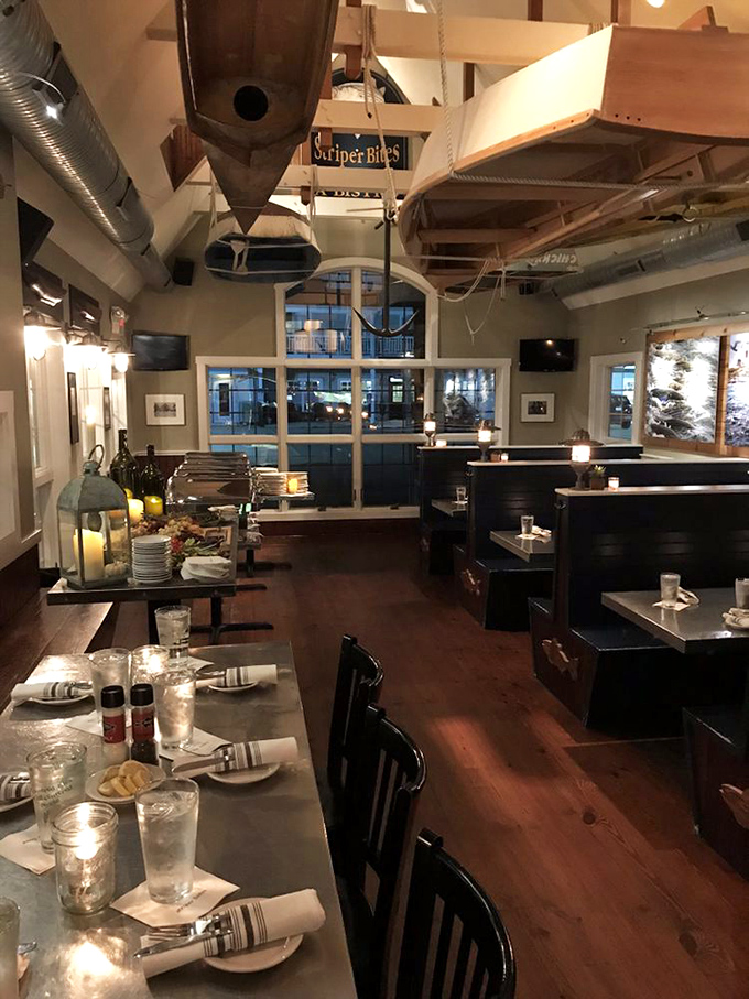 Wooden boats suspended from the ceiling aren't just decor&mdash;they're a nod to Delaware's maritime soul. The warm interior practically whispers "seafood sanctuary."