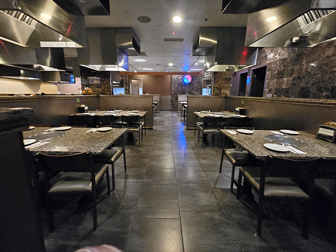 Sleek granite tables with built-in grills await your culinary adventure&mdash;restaurant minimalism at its finest where the food, not the decor, steals the show.