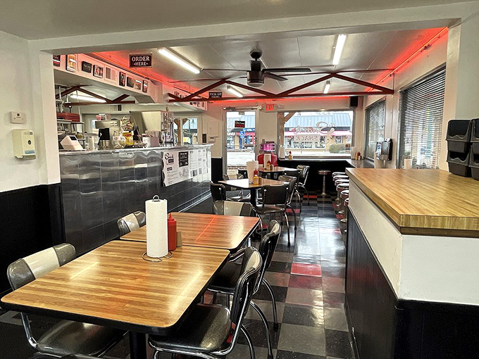 Classic diner vibes with those red ceiling accents&mdash;like sitting in a time machine that happens to serve incredible burgers.